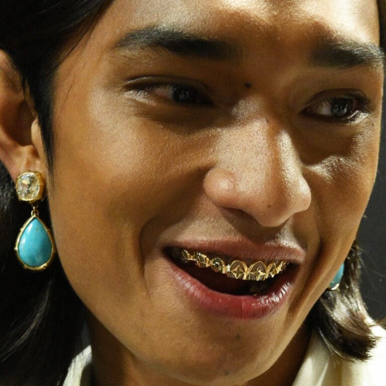 Gold braces at Louis Vuitton Fall 2024-2025 - RUNWAY MAGAZINE ® Official